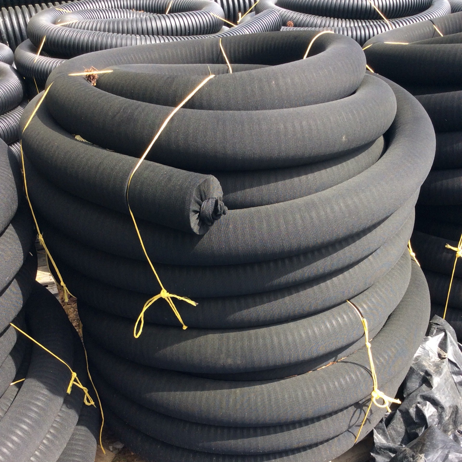 4” x 100” Perforated Pipe with Sock | Alex Pinestraw & Mulch, LLC
